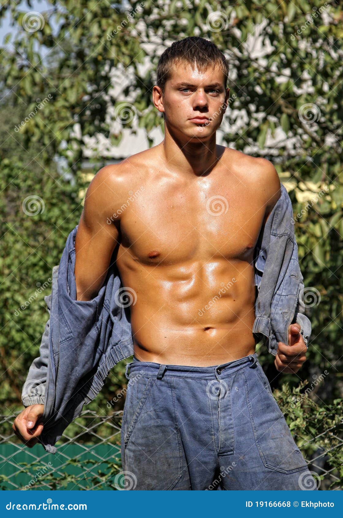 Muscle Young Worker in Working Clothes Stock Photo - Image of shorts ...