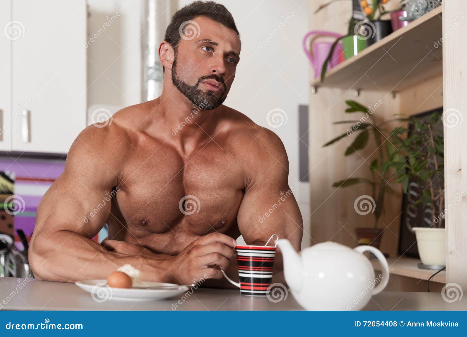Muscle Shirtless Bachelor Man Have a Breakfast in Kitchen Stock Photo ...