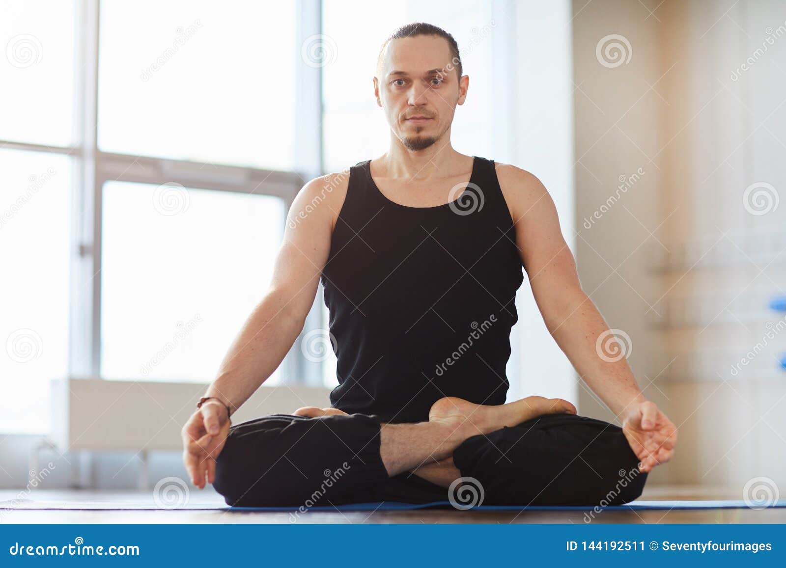 Muscled Young Man Meditating Alone Stock Image - Image of concentrated ...