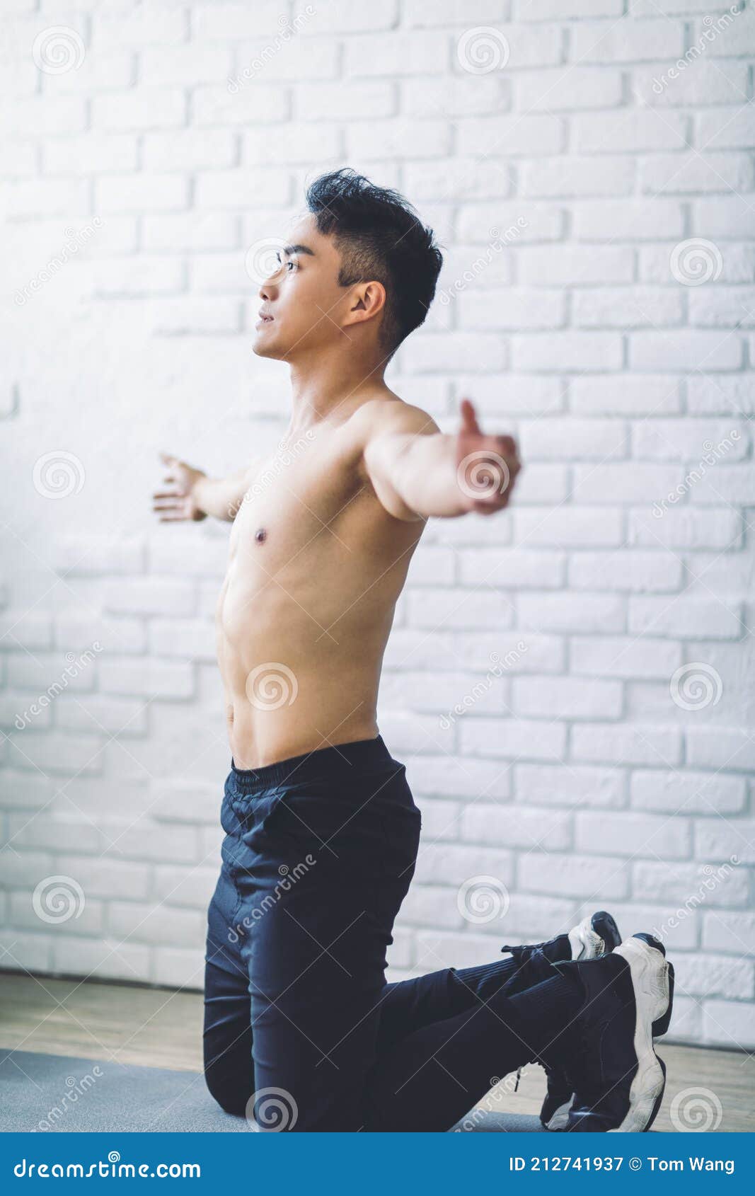 Muscular Asian Young Man Doing Exercises on Floor at Home Stock Image ...