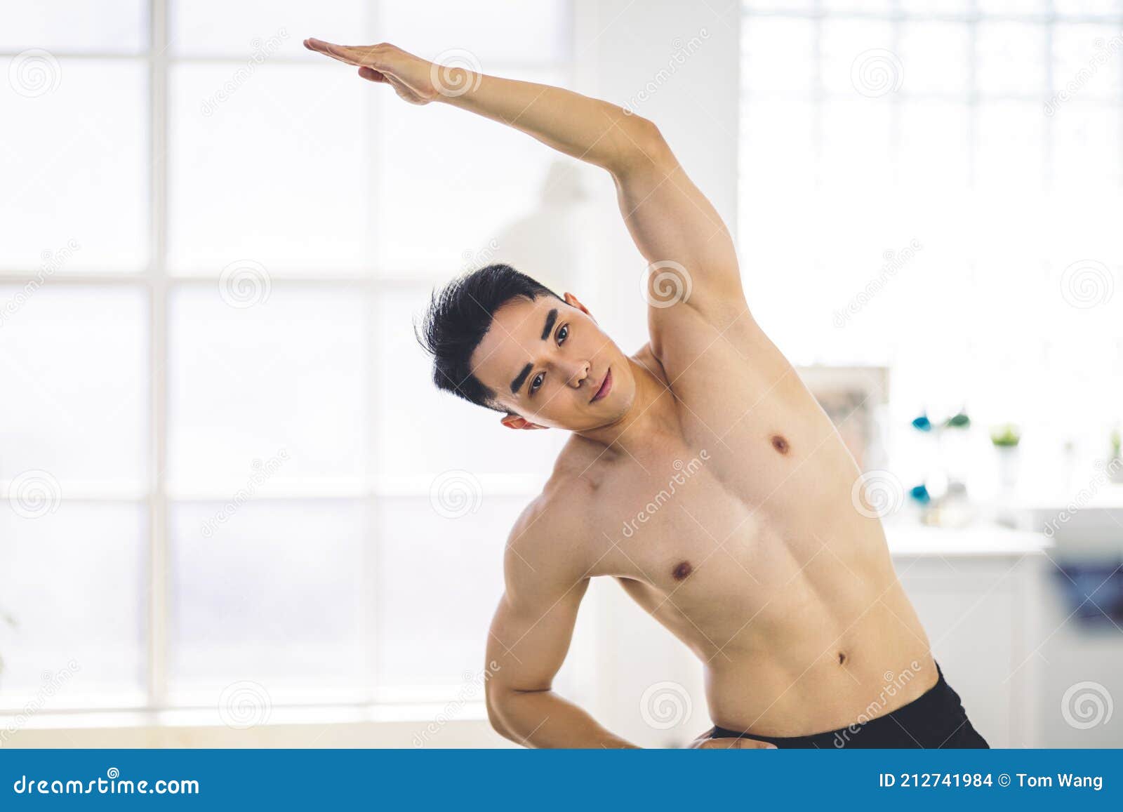 Muscular Asian Young Man Doing Exercises at Home Stock Photo - Image of ...