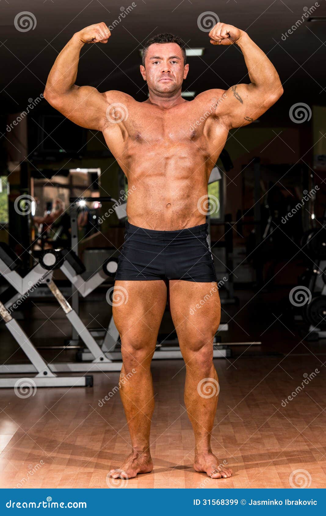 Muscular Body Builder Showing His Front Double Biceps Stock Image ...