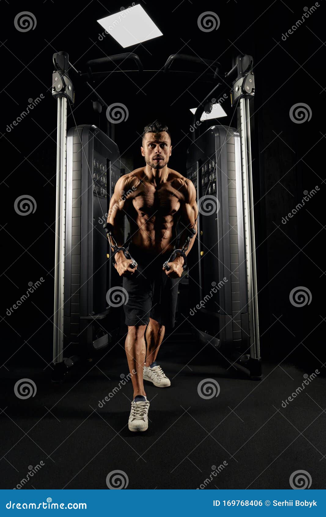 Muscular Bodybuilder Doing Crossover Chest Exercise. Stock Photo ...