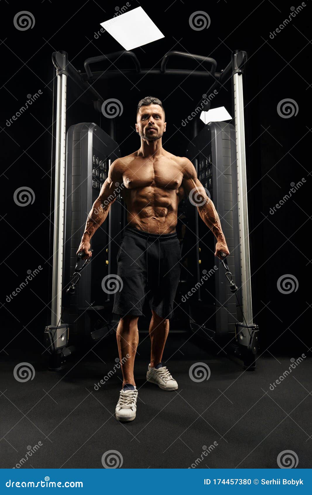 Muscular Bodybuilder Doing Crossover Chest Exercise. Stock Photo ...