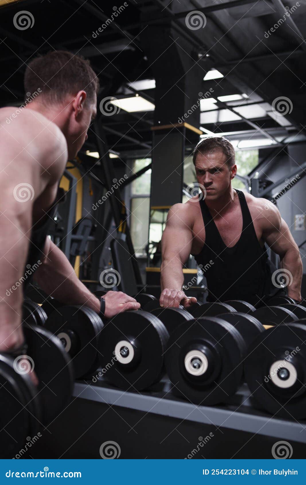 Muscular Bodybuilder Doing Dumbbell Row Exercise Stock Photo - Image of ...