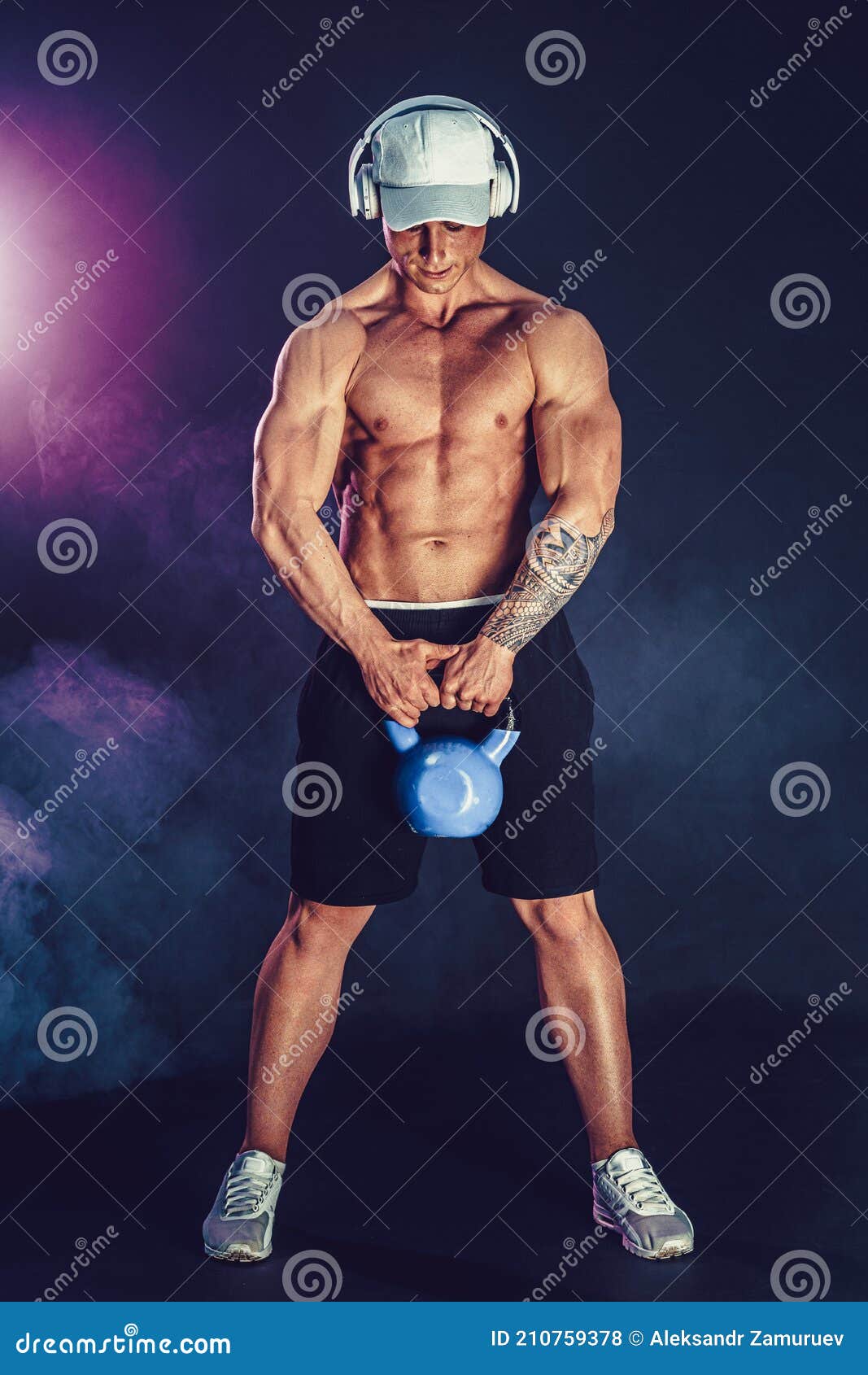 Muscular Bodybuilder Doing Exercise with Kettlebell. Studio Shot Stock ...