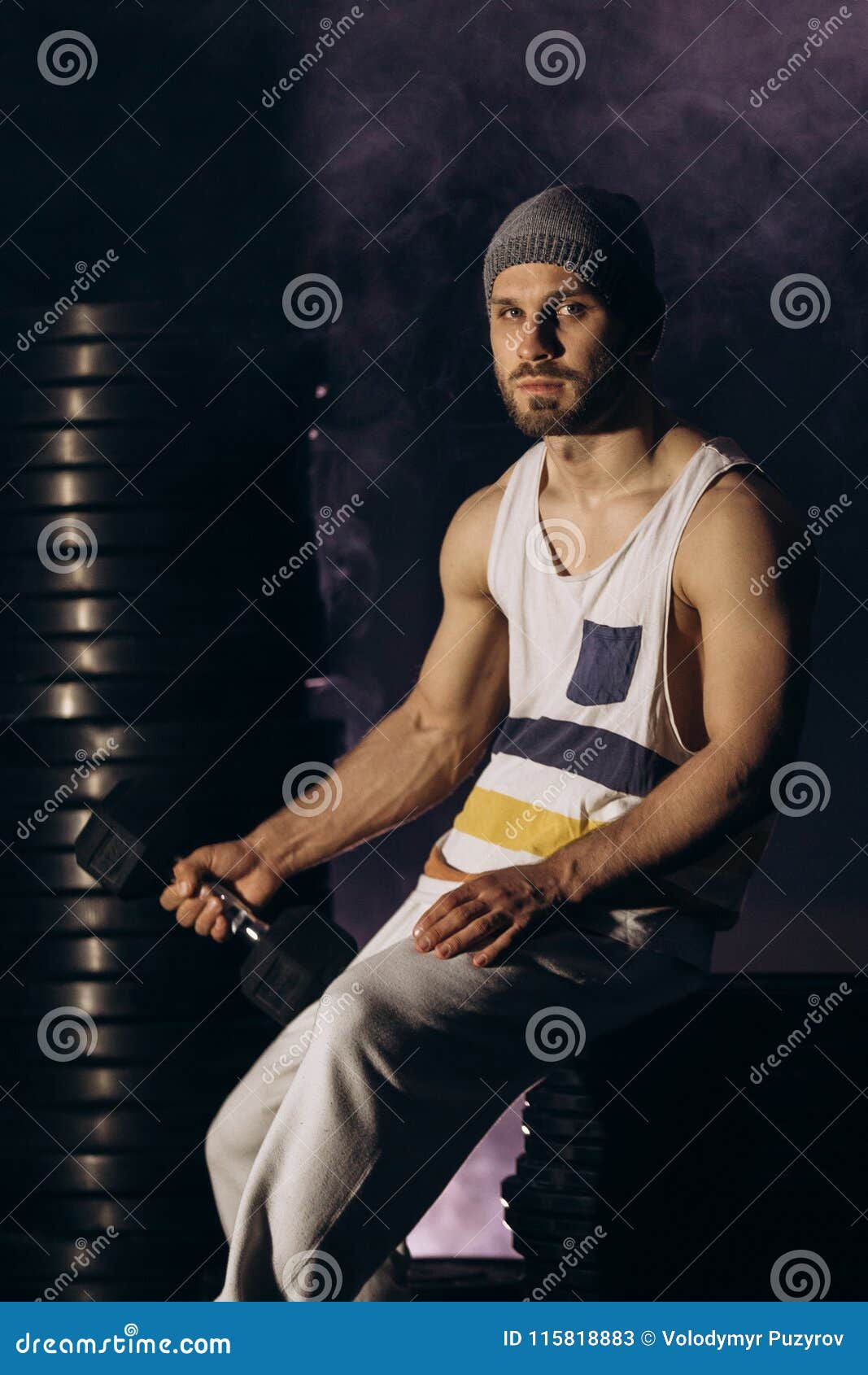 Muscular Bodybuilder with Dumbbells in Smoke Stock Image - Image of ...