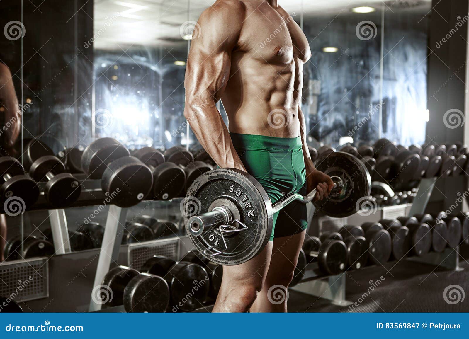 Muscular Bodybuilder Guy Doing Exercises with Big Dumbbell Stock Image ...
