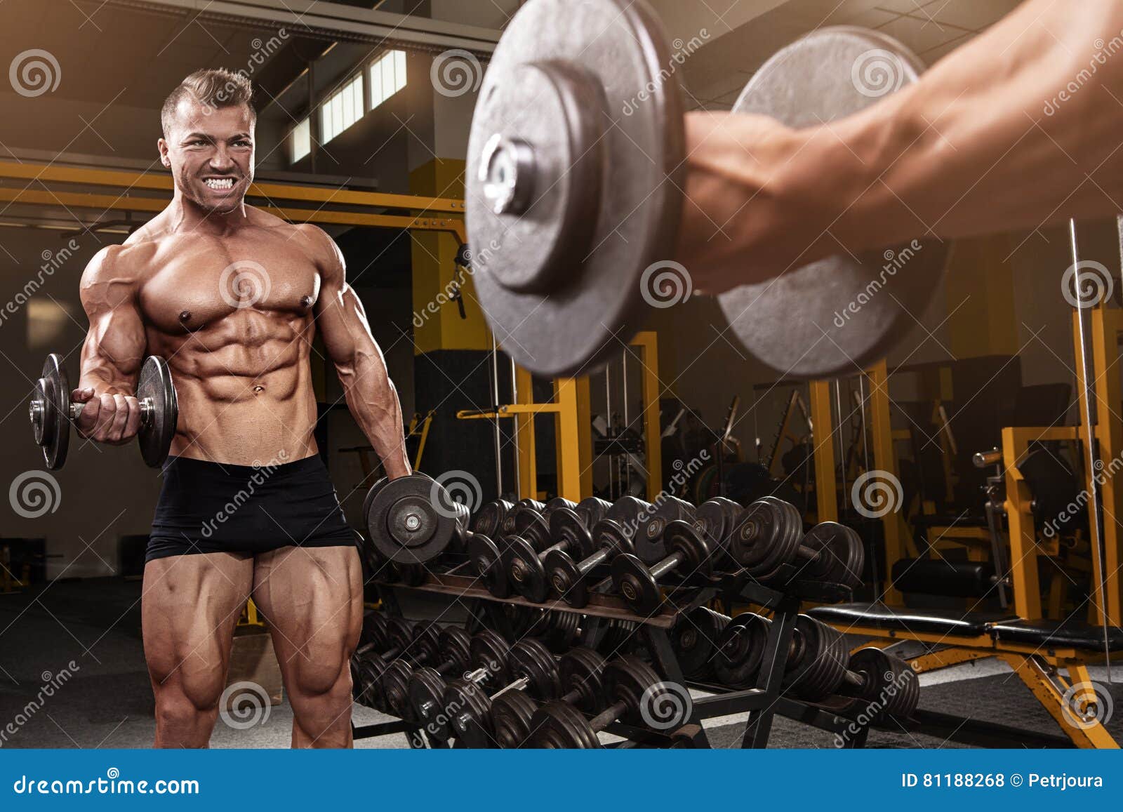 Muscular Bodybuilder Guy Doing Exercises with Dumbbell Stock Photo ...
