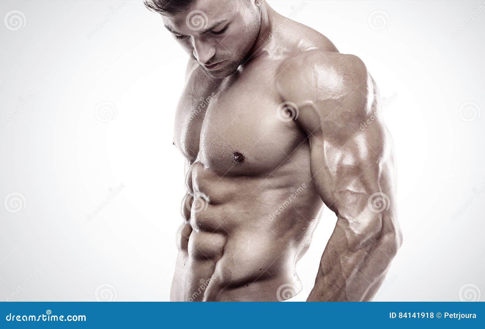 Muscular Bodybuilder Guy Standing Over White Background Stock Photo ...