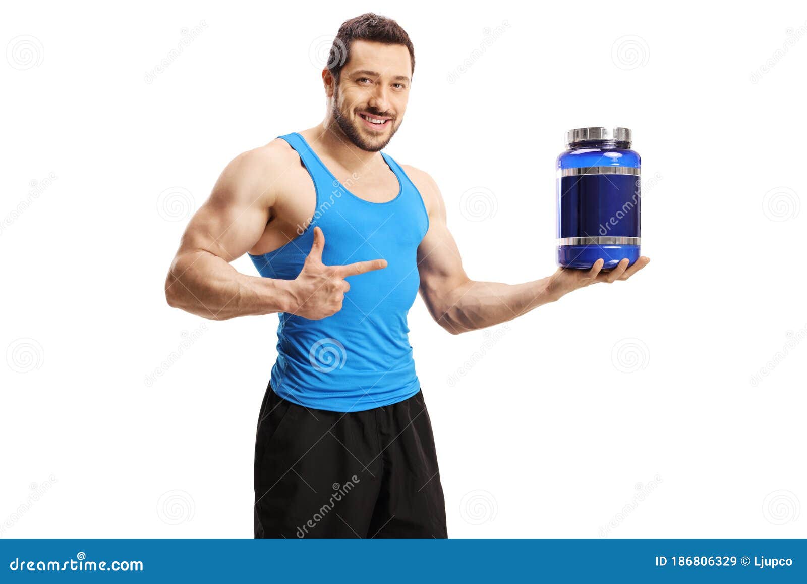 Muscular Bodybuilder Holding a Pack of Protein Powder and Pointing ...