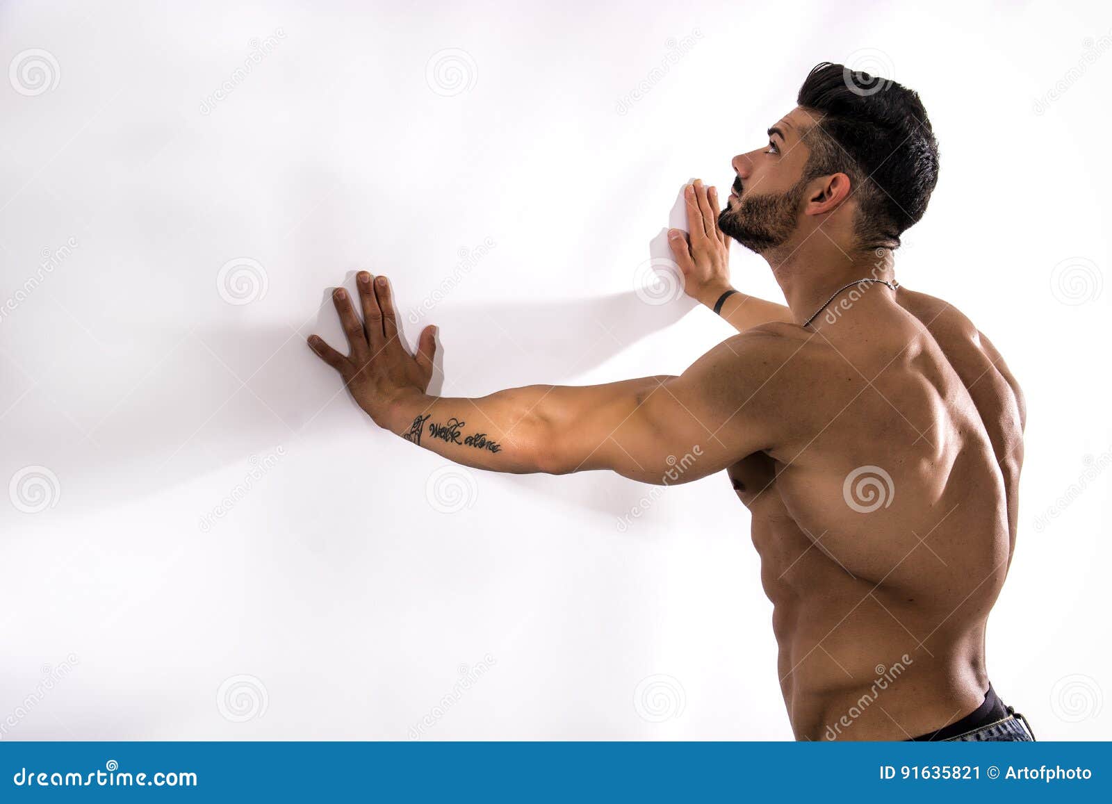 Muscular Bodybuilder Leaning Against White Wall Stock Image - Image of ...