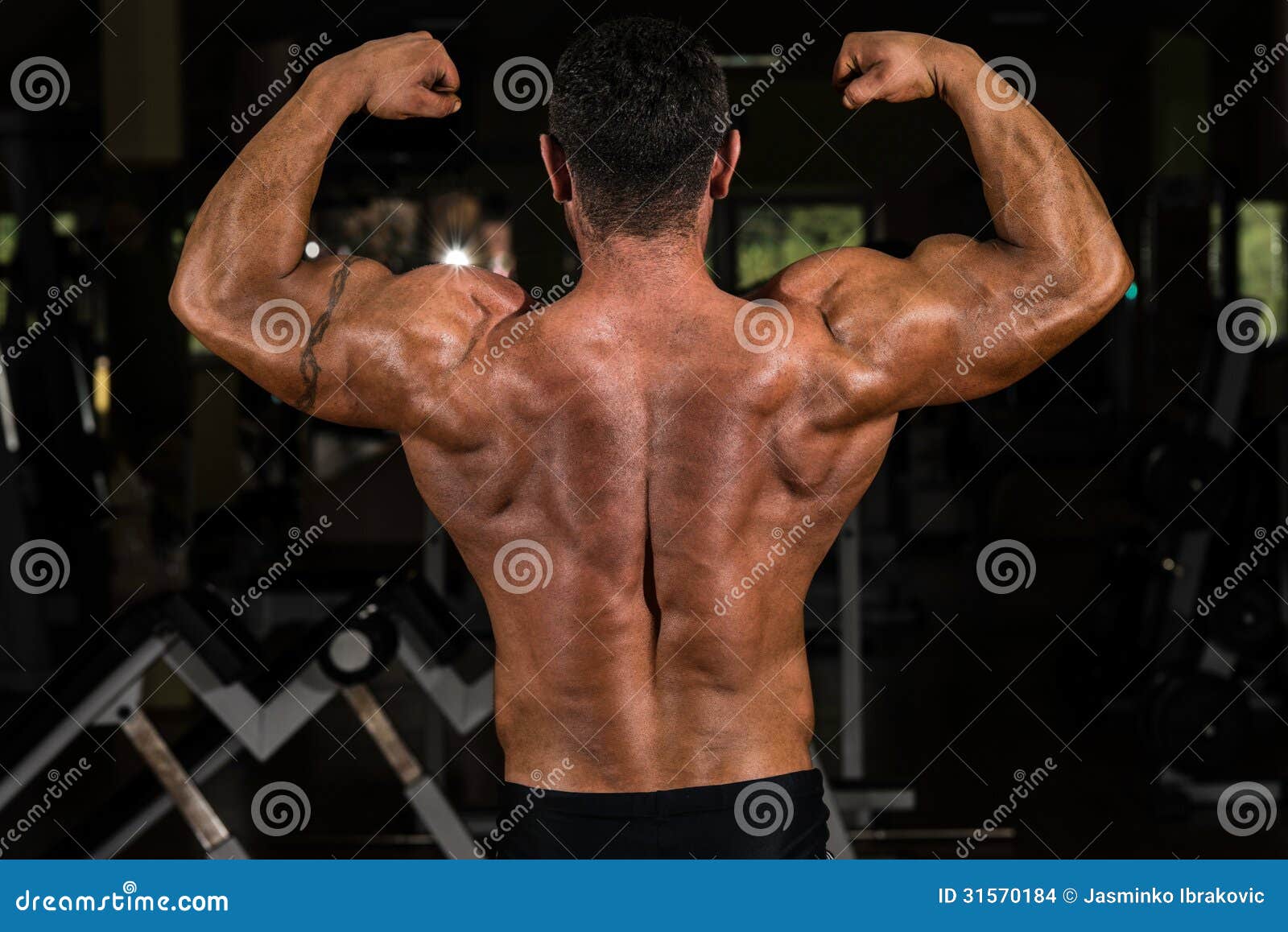 Back Double Biceps Pose By Brutal Caucasian Bodybuilder On Grunge ...