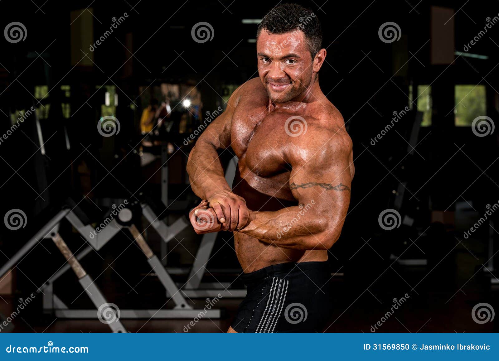Muscular Bodybuilder Showing His Side Chest Stock Photo - Image of flex ...