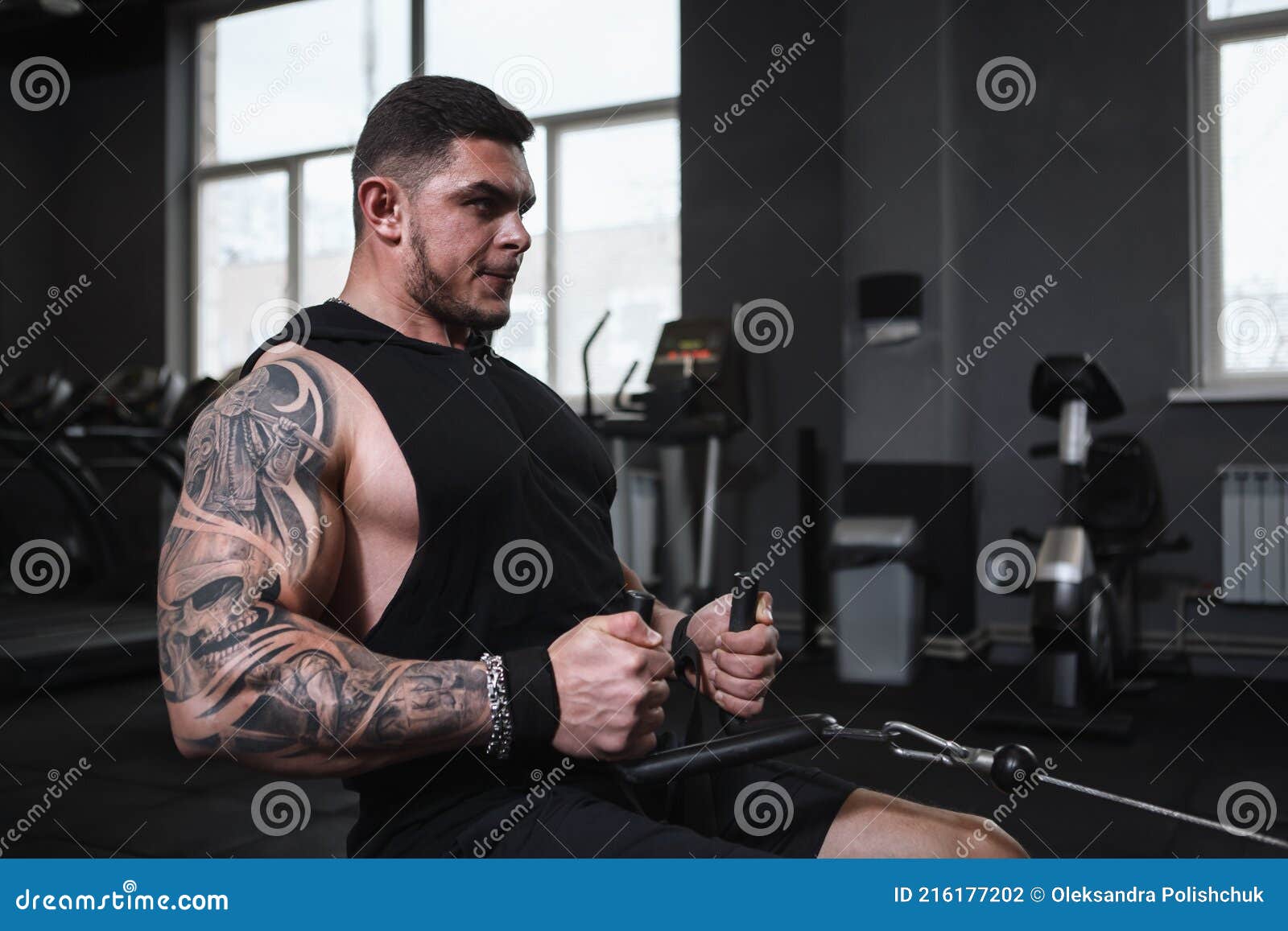Muscular Bodybuilder Working Out at Gym Stock Photo - Image of machine ...