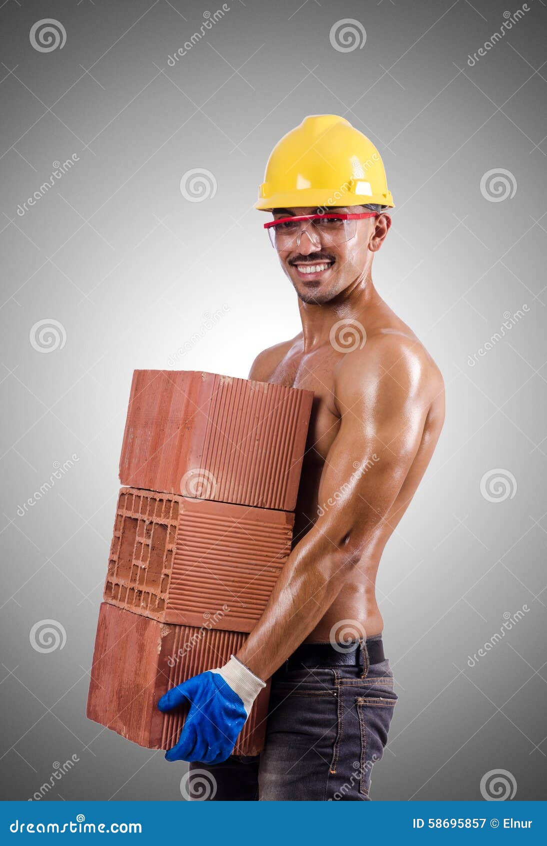 Muscular Builder with Bricks Against Gradient Stock Image - Image of ...