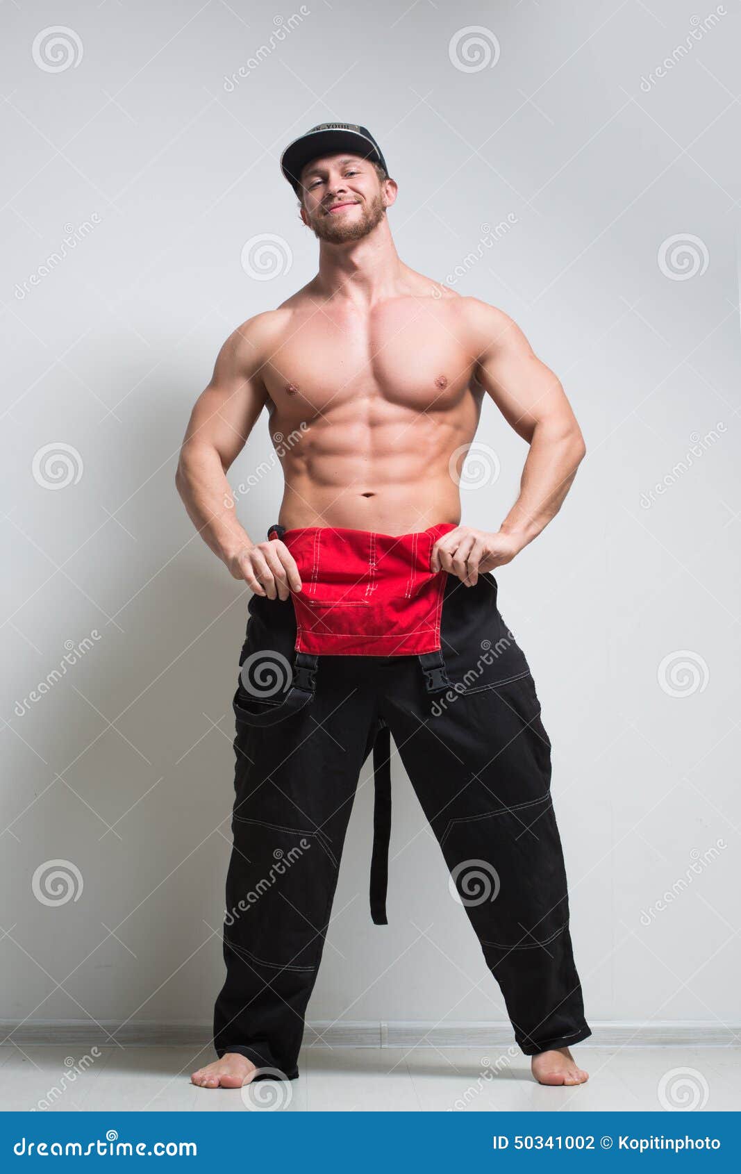 Muscular Construction Worker In Overalls Stock Photo | CartoonDealer ...