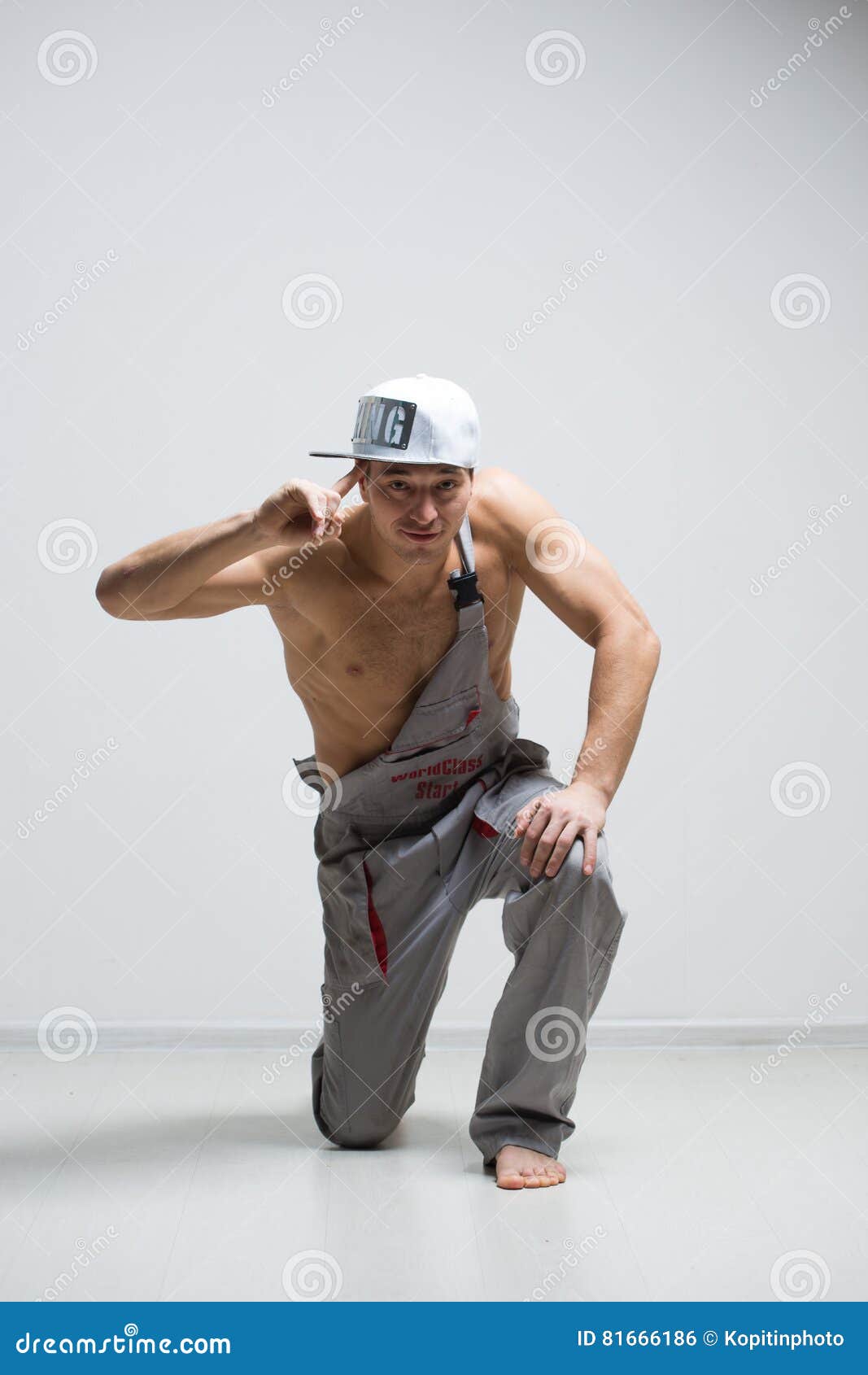 Muscular Construction Worker in Overalls Stock Photo - Image of pecs ...