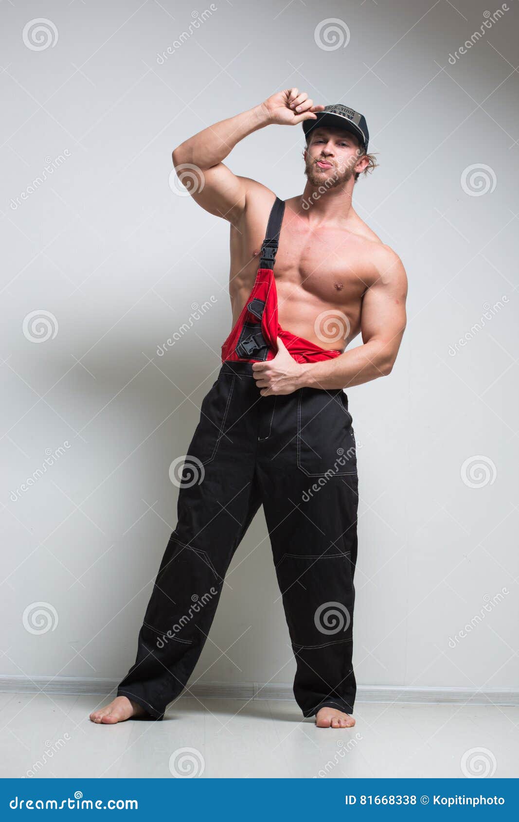 Muscular Construction Worker in Overalls Stock Photo - Image of ...