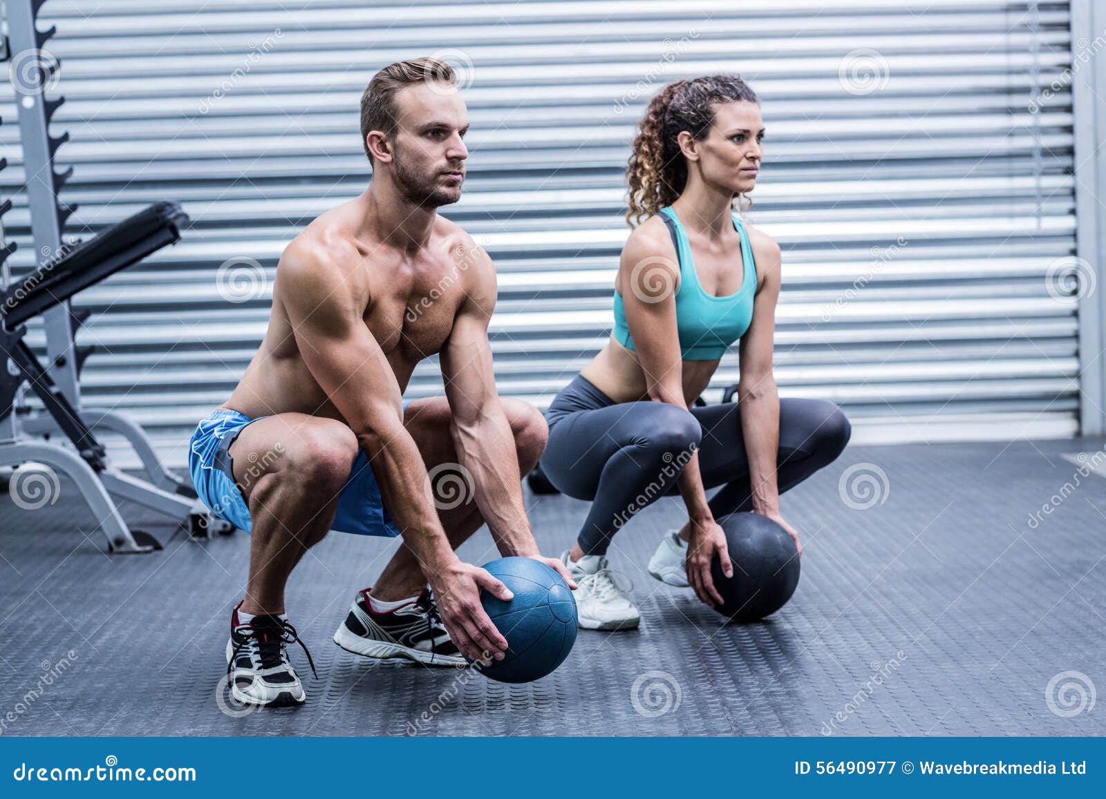 Muscular Couple Doing Ball Exercise Stock Image - Image of exercising ...
