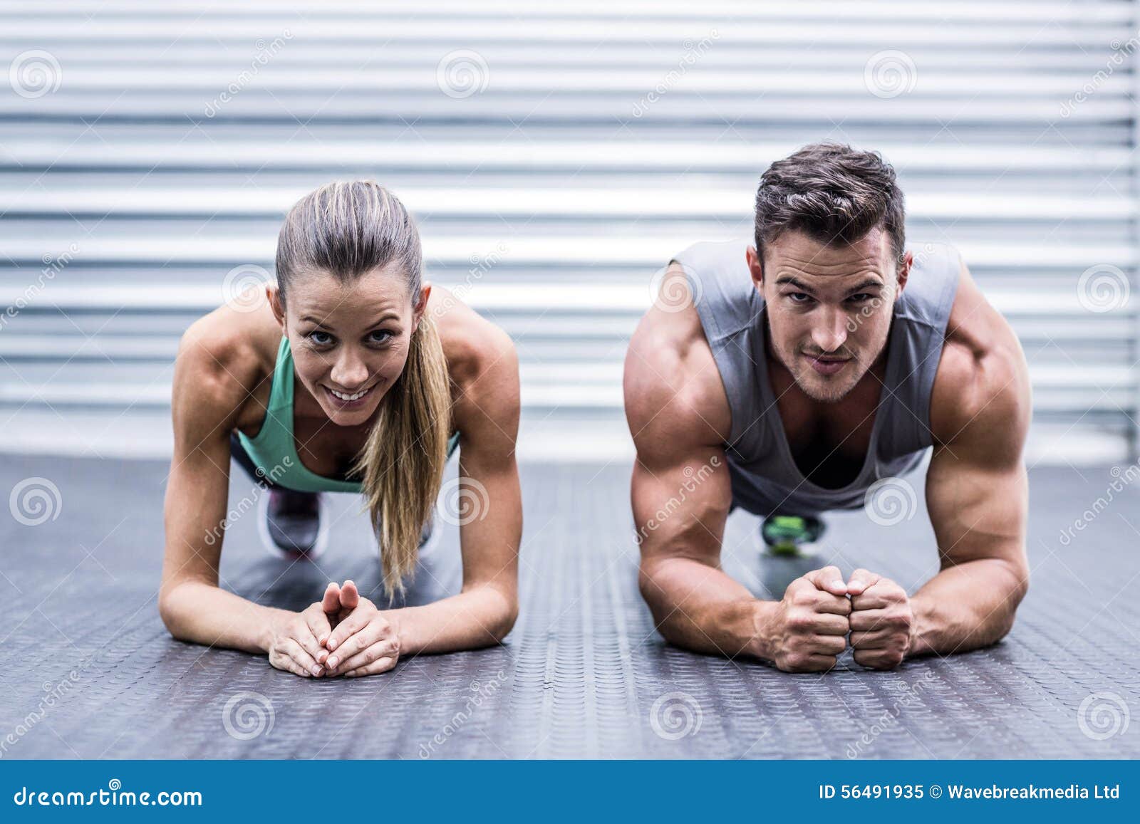 Muscular Couple Doing Planking Exercises Stock Image - Image of ...