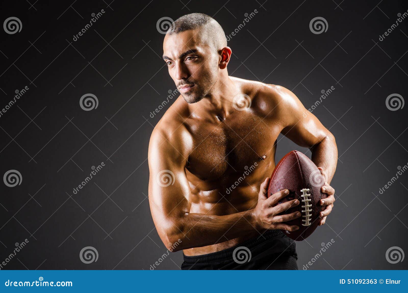 Muscular football player stock image. Image of playing - 51092363