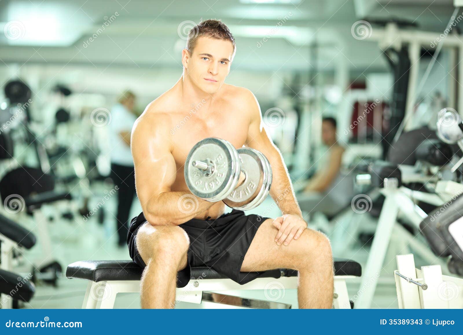 Muscular Guy Lifting Weights in a Gym Stock Image - Image of dumbbell ... Muscular Guy Lifting Weights in a Gym Stock Image - Image of dumbbell ...