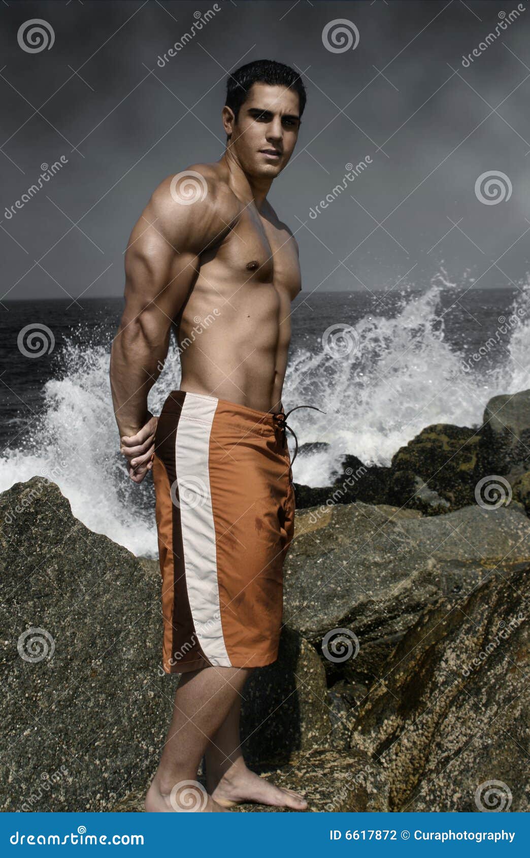 Muscular guy by the ocean stock photo. Image of portrait - 6617872