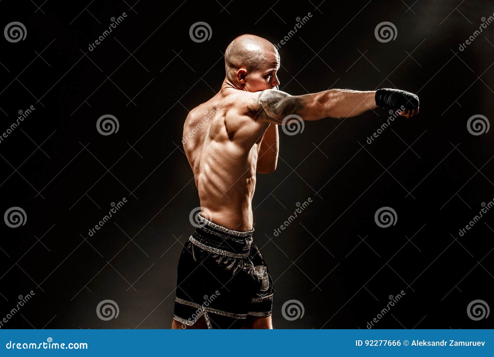 Muscular Kickbox or Muay Thai Fighter Punching Stock Photo - Image of ...