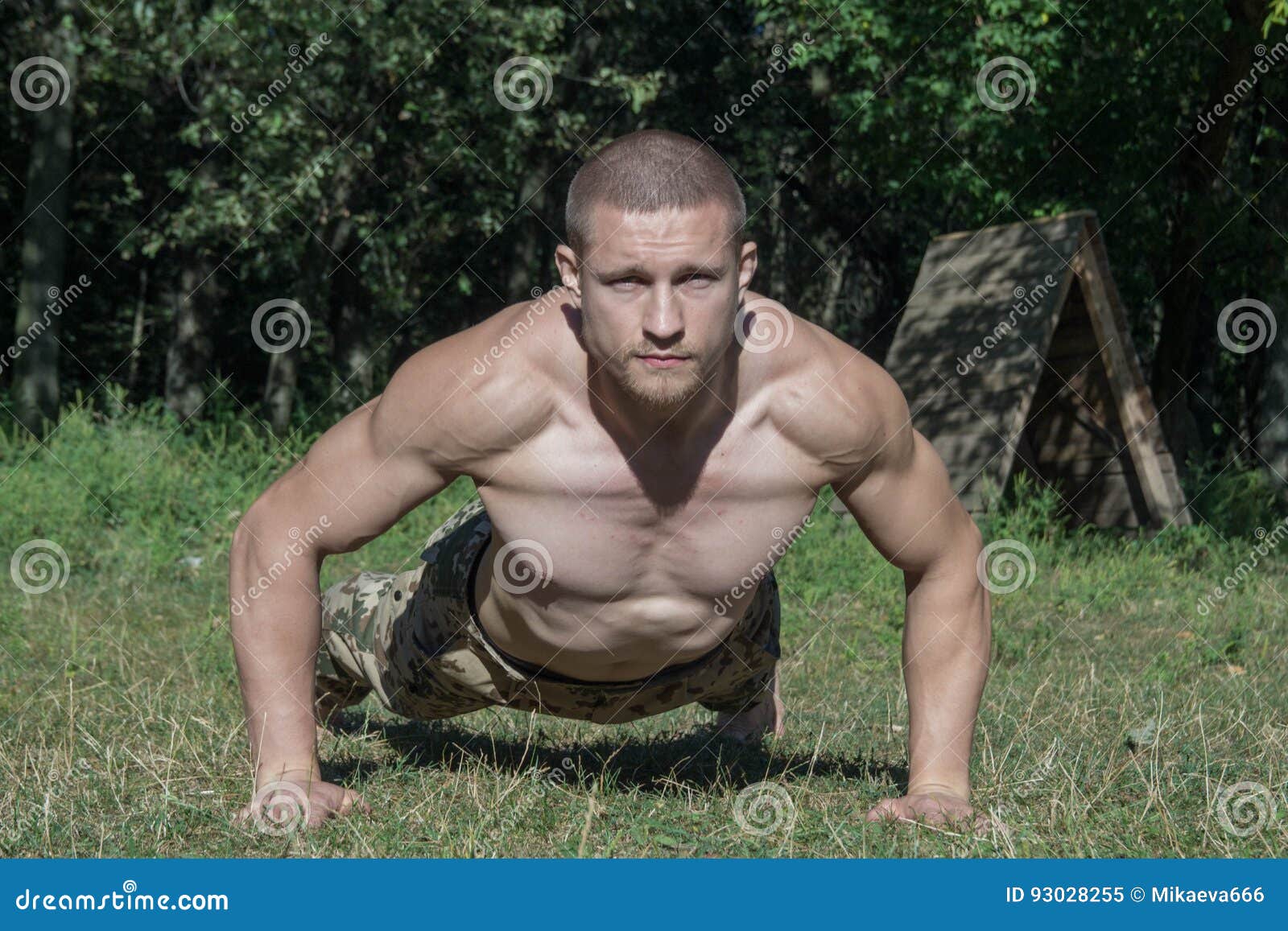 A Muscular Man with a Bare Chest is Squeezed Stock Image - Image of ...