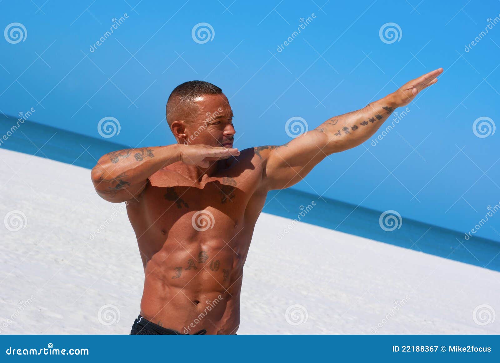 Muscular Man on Beach in a Positive Pose Stock Image - Image of ...