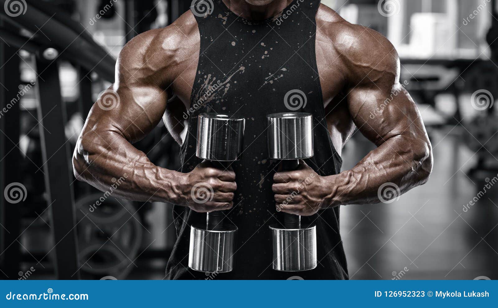 Muscular Man Bodybuilder Working Out in Gym. Strong Man Doing Exercise ...