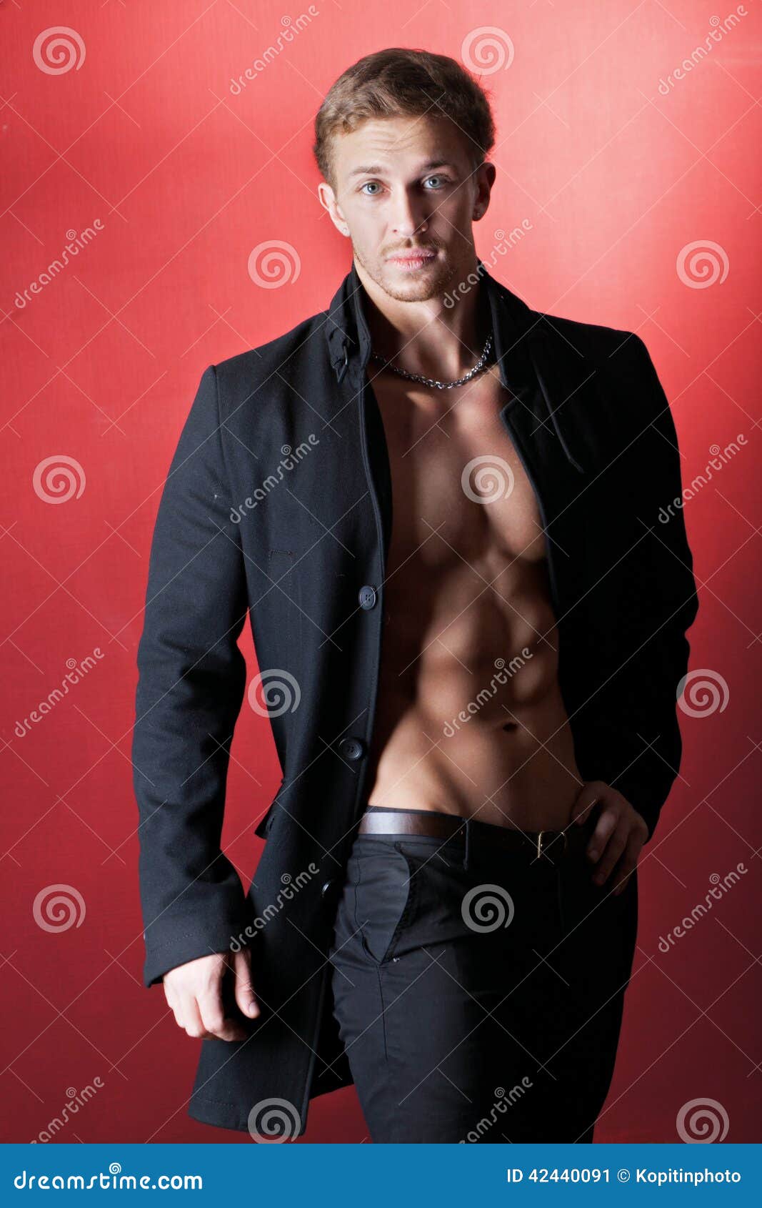 Muscular man in a coat. stock image. Image of athlete - 42440091