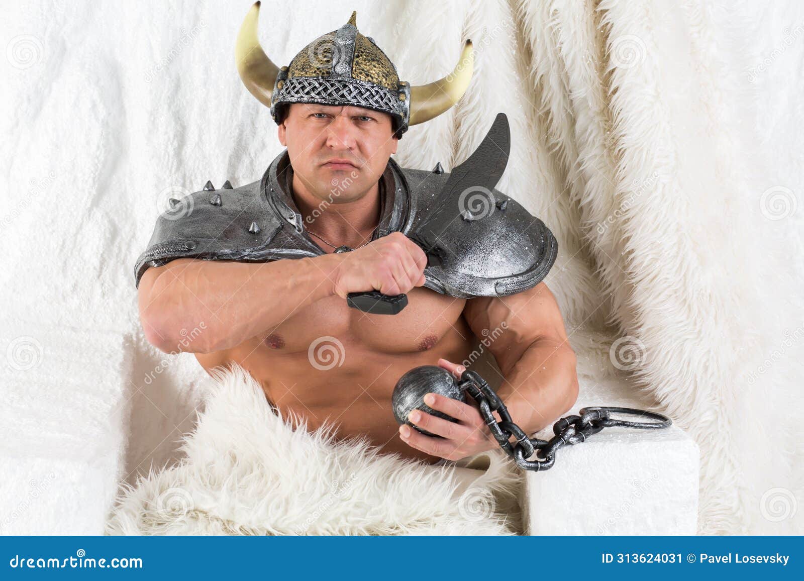 A Muscular Man in Costume Viking with a Sword and Stock Image - Image ...