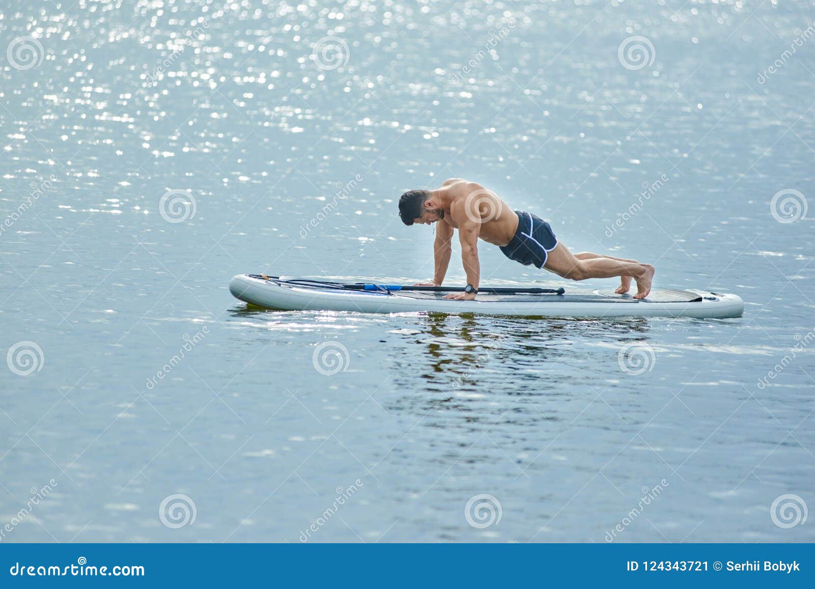 Muscular Man Doing Emphasis on the Forearm with Both Hands Down on Sup ...