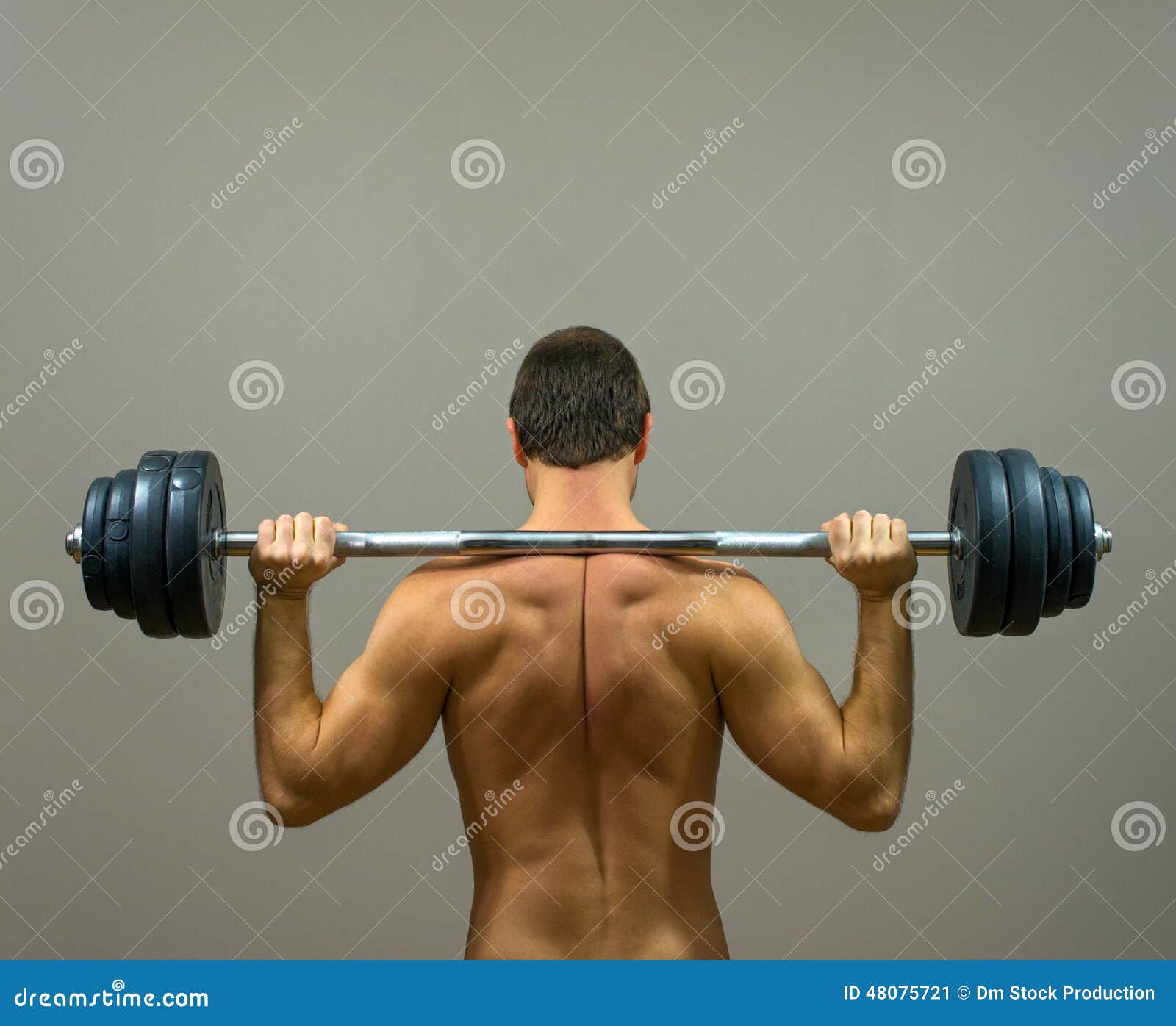 Muscular Man Doing Exercises with Barbell. Stock Image - Image of ...