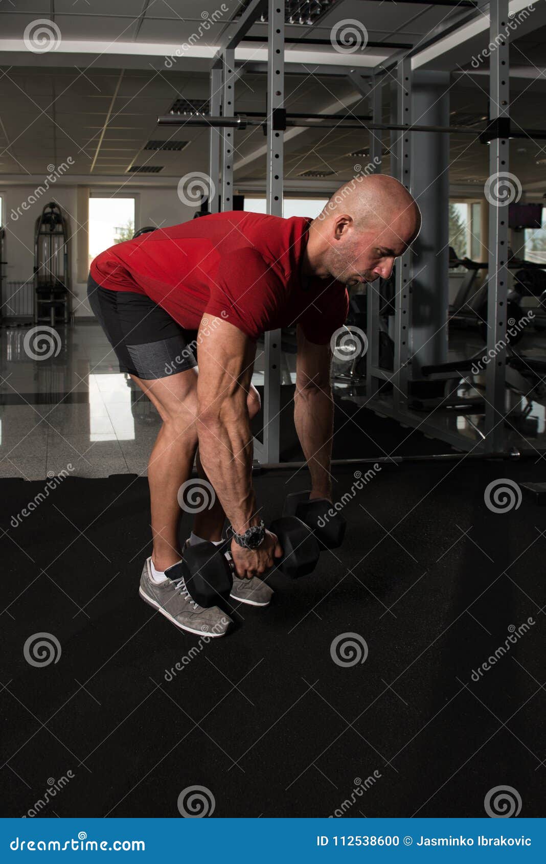 Muscular Man Doing Heavy Weight Exercise for Back Stock Photo - Image ...