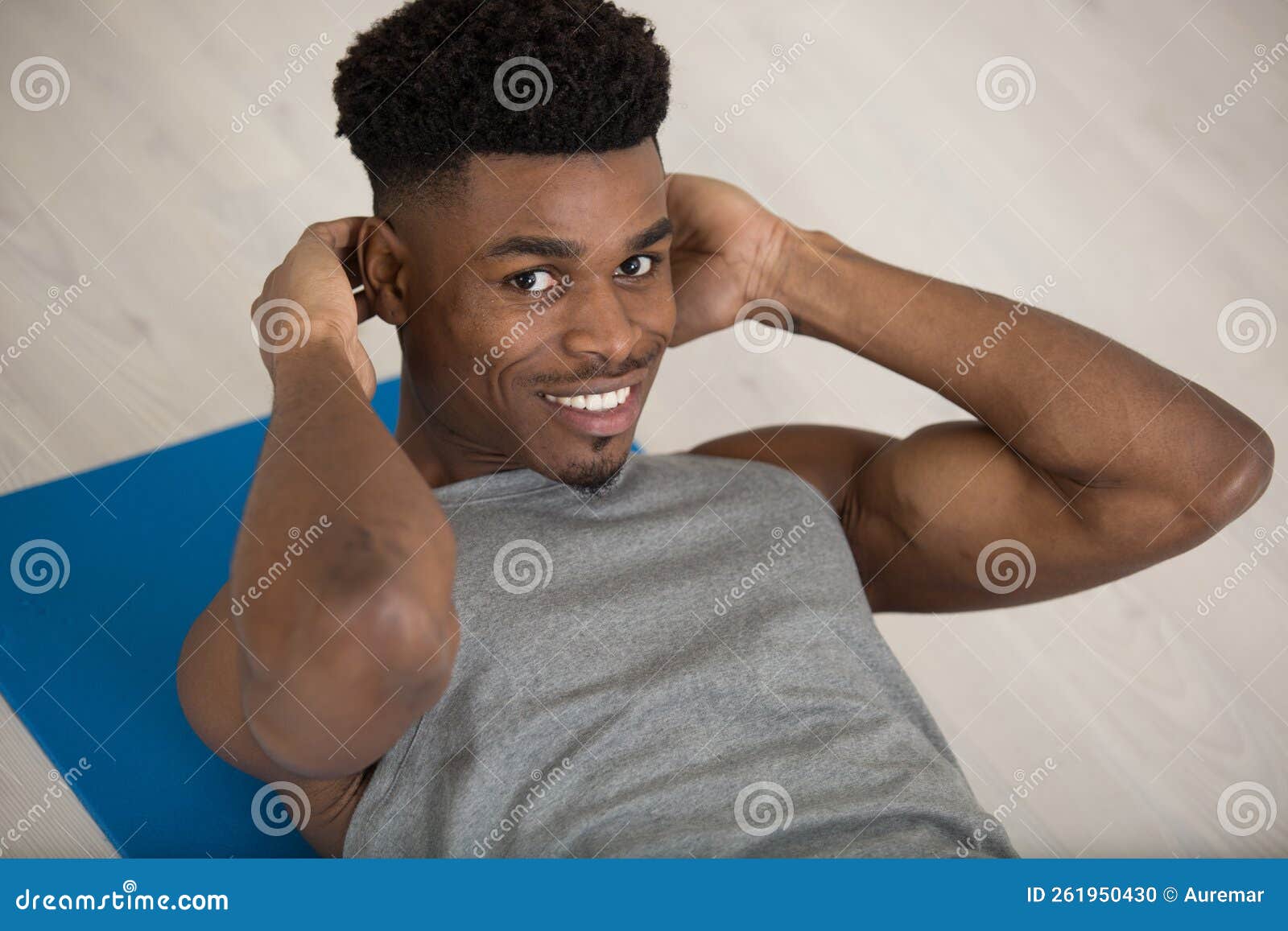 Muscular man doing sit-ups stock photo. Image of lifestyle - 261950430
