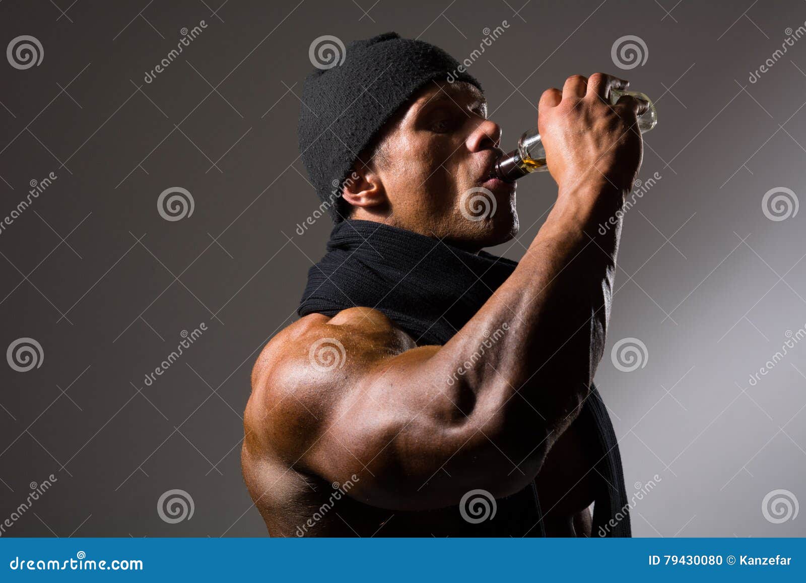 Muscular Man Drinking Alcohol from a Bottle Stock Photo - Image of ...