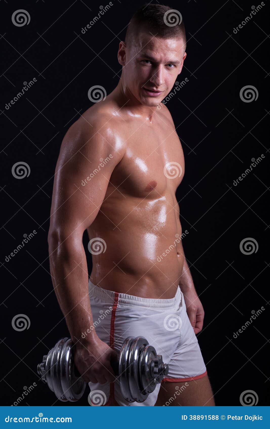 Muscular man with dumbbell stock photo. Image of muscle - 38891588