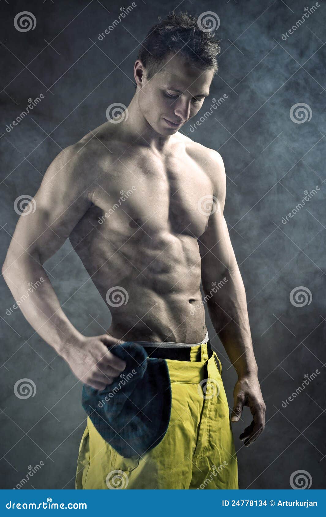 Muscular Man in a Fashion Pose with Cap Stock Photo - Image of health ...