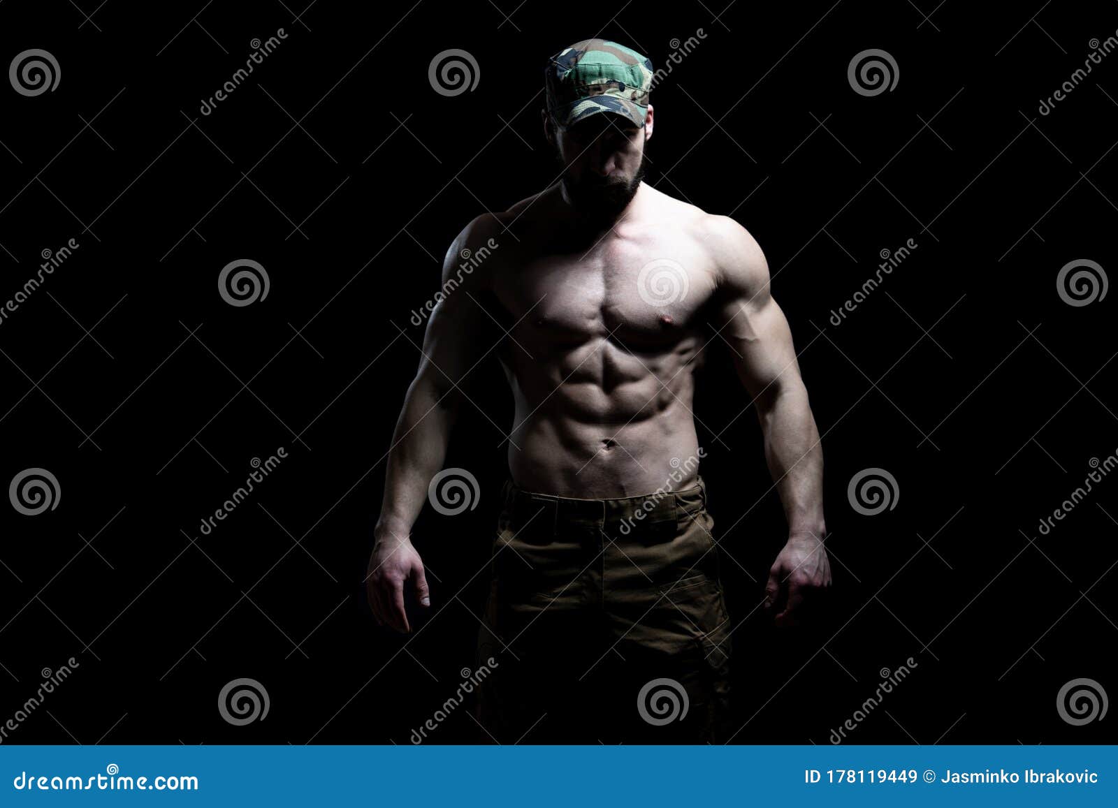 Muscular Man Flexing Muscles on Black Background Stock Image - Image of ...
