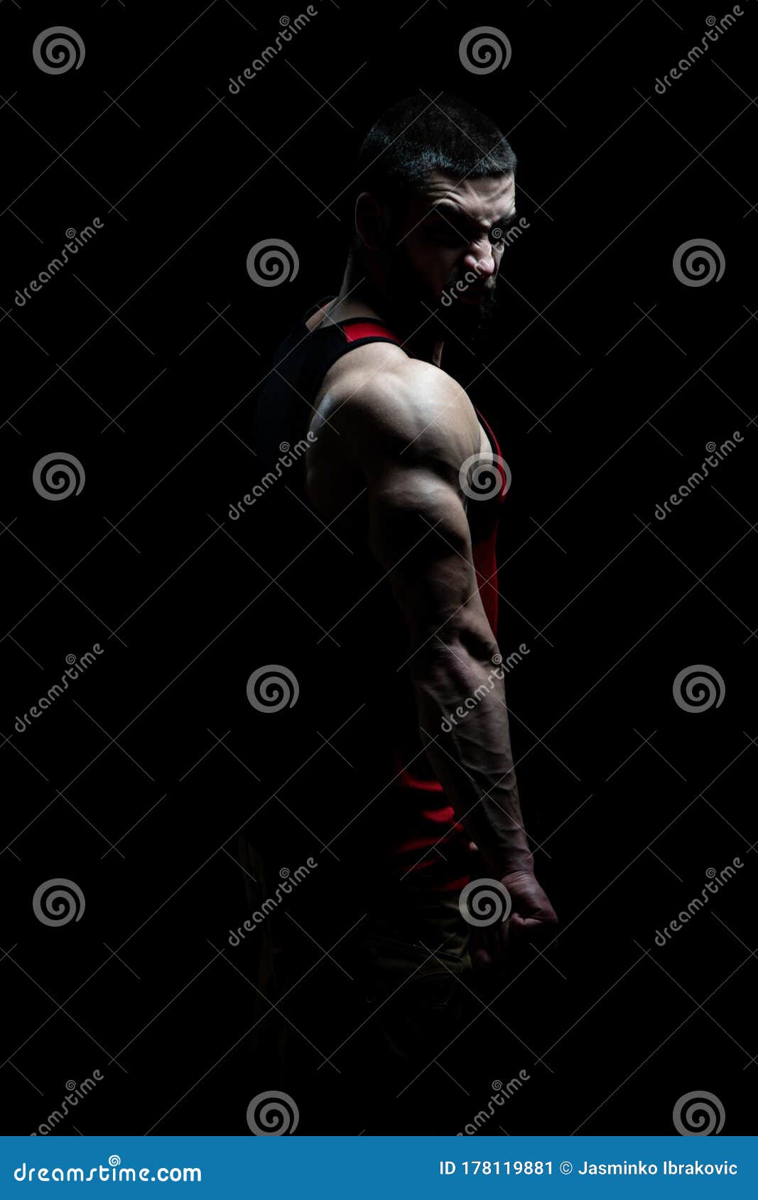 Muscular Man Flexing Muscles on Black Background Stock Image - Image of ...