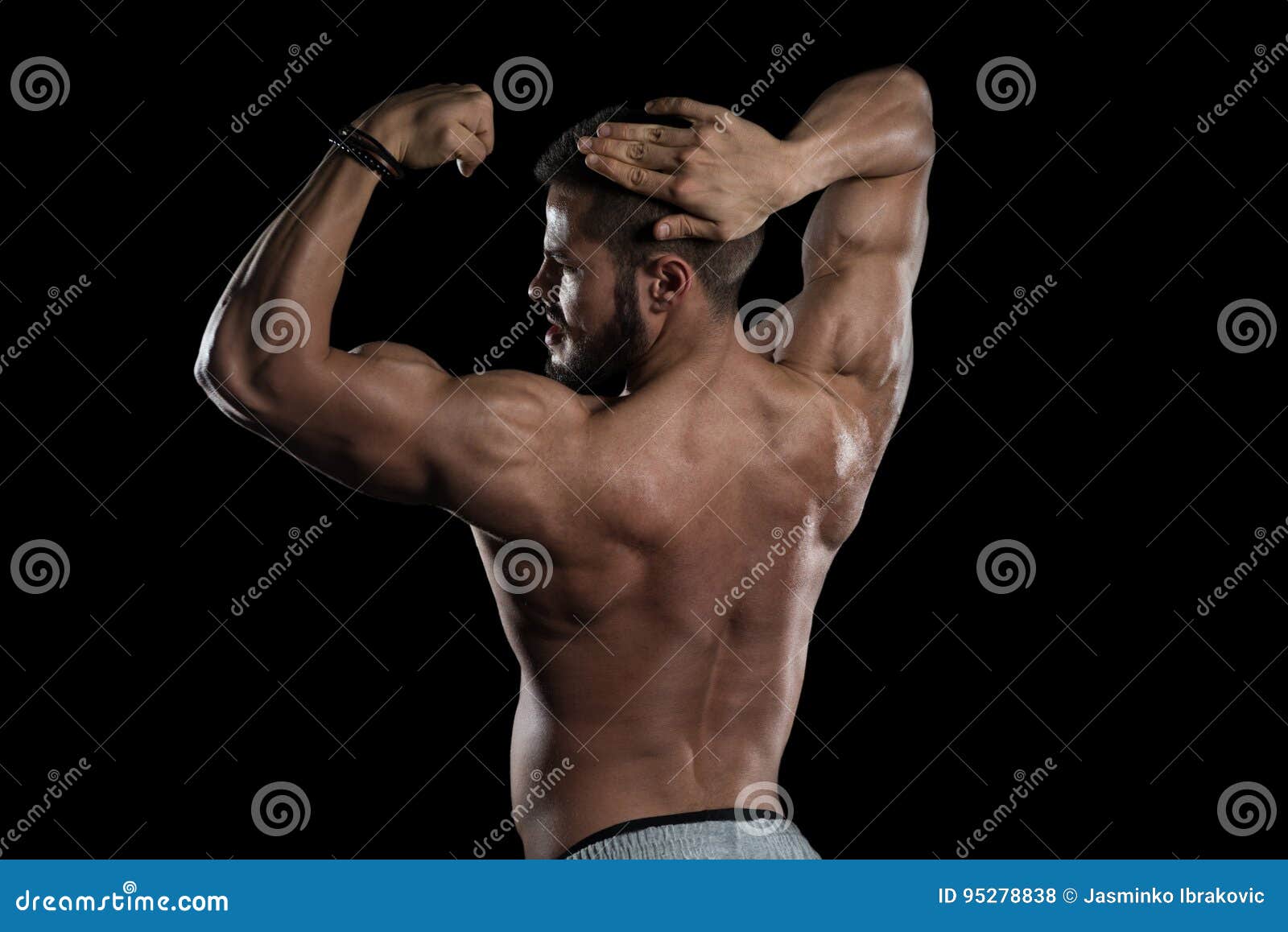 Muscular Man Flexing Muscles on Black Background Stock Photo - Image of ...