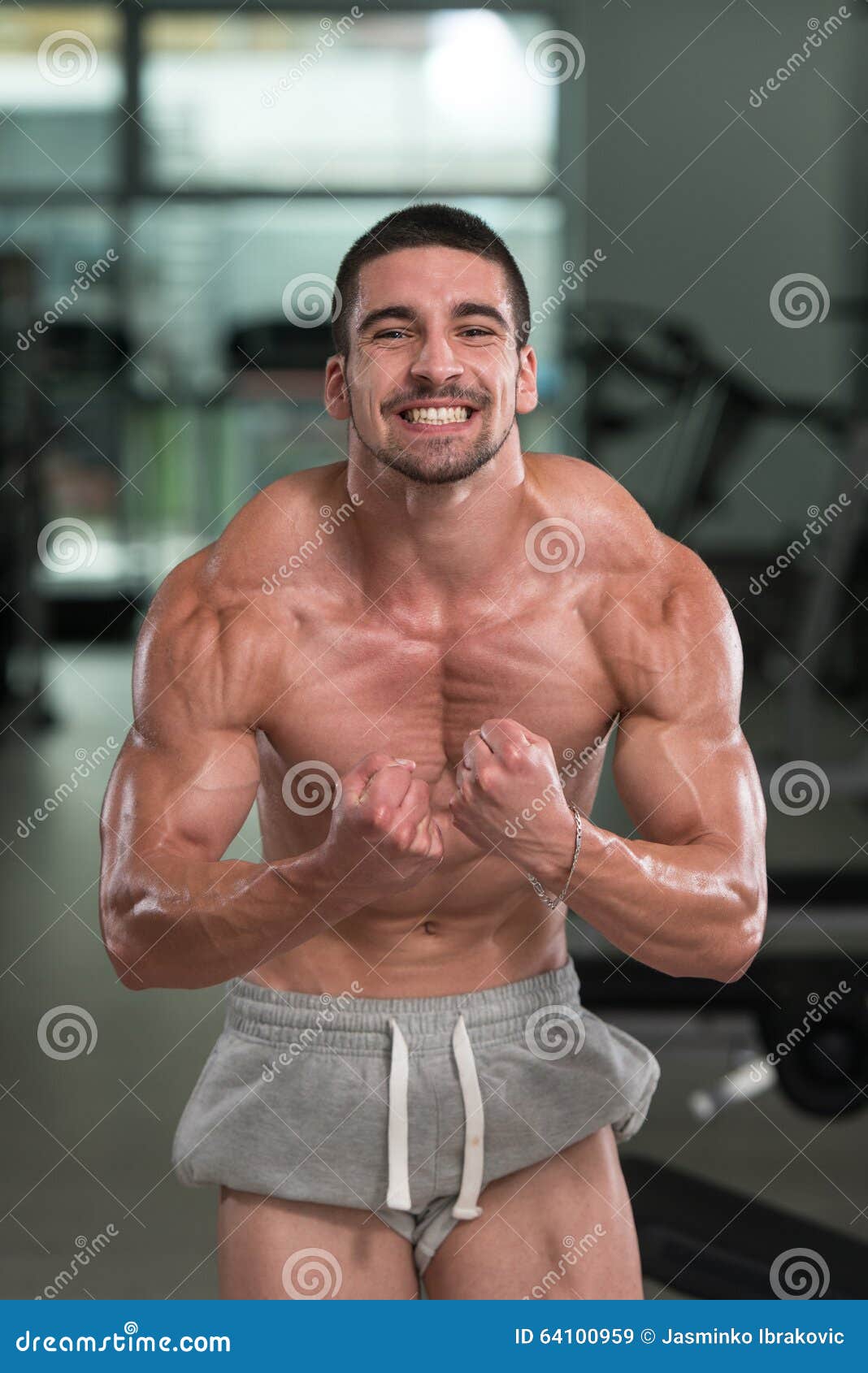 Muscular Man Flexing Muscles in Gym Stock Image - Image of exercises ...