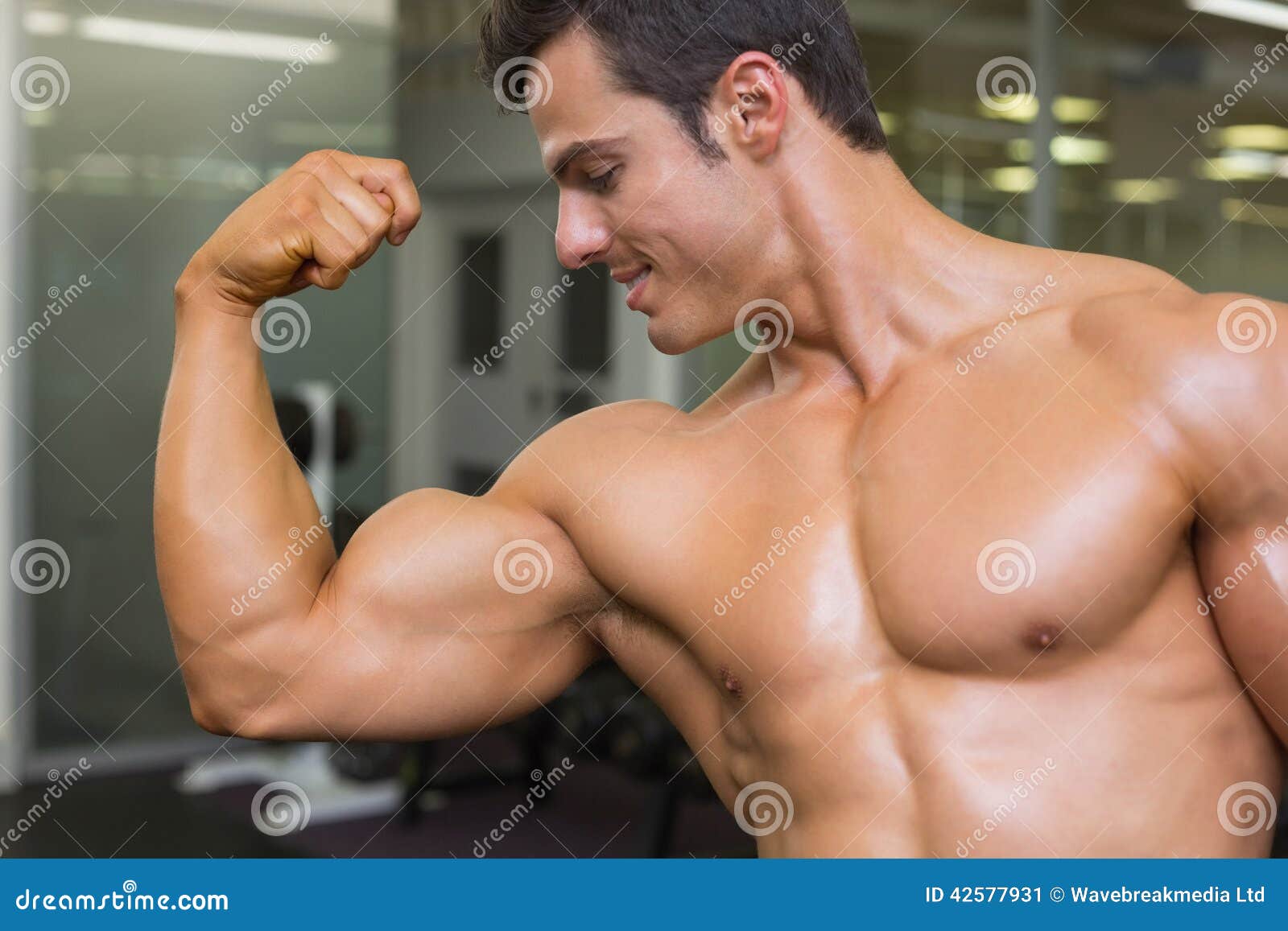 Muscular Man Flexing Muscles in Gym Stock Image - Image of closeup ...