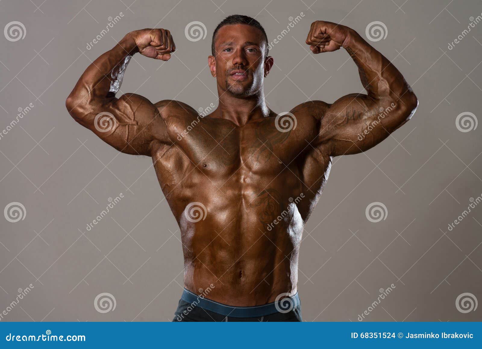 Muscular Man Flexing Muscles Stock Photo - Image of flexing, biceps ...