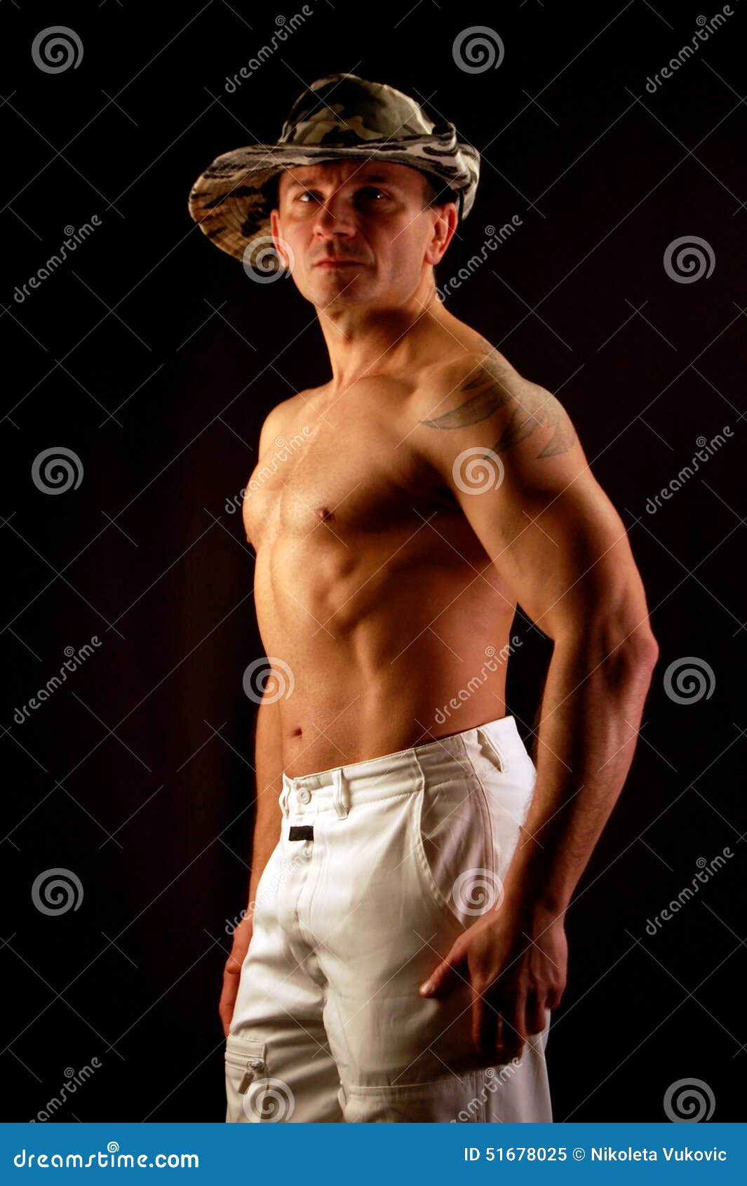 Muscular man with hat stock image. Image of body, fashion - 51678025