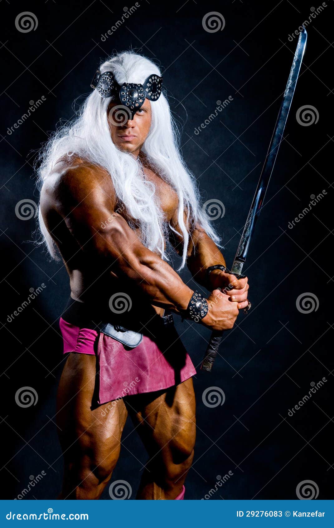 Muscular Man In An Image Of A Barbarian With A Raised Sword ...