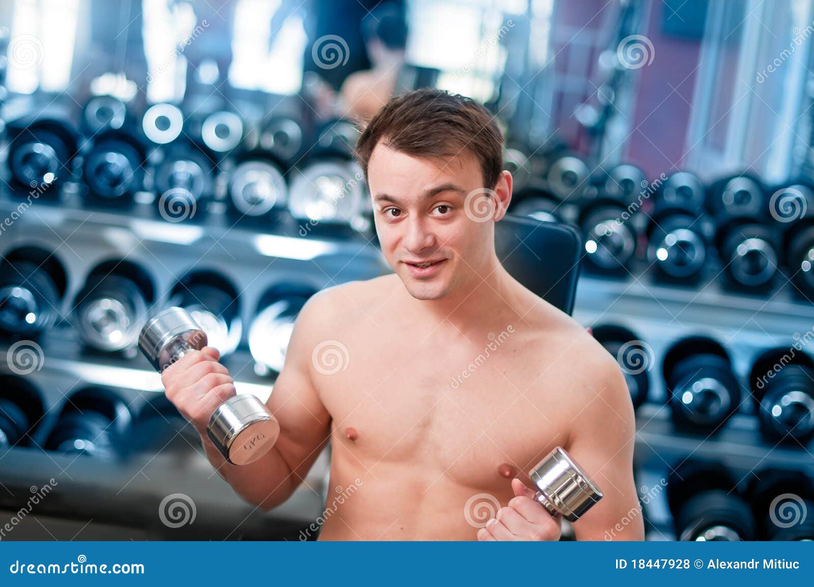Boy Lifting Dumbbell And Pointing His Arm Muscles Stock Image ...